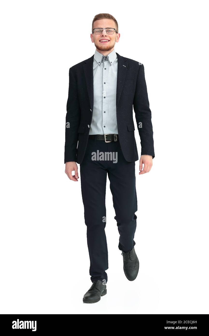 in full growth. smiling young business man striding forward Stock Photo ...
