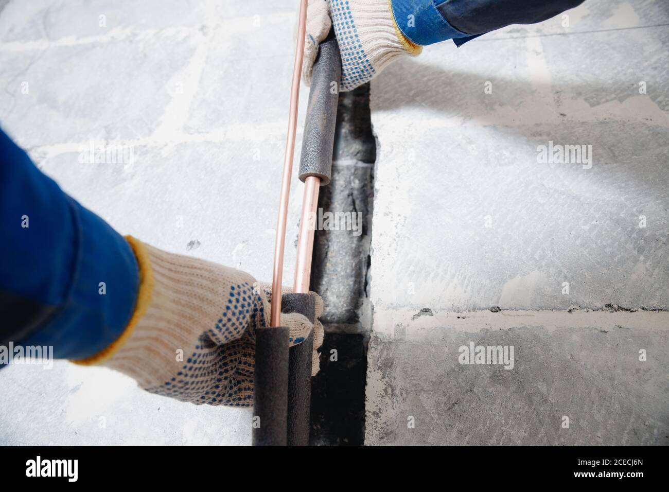 Installation of pipe channel for connecting air conditioner in concrete ...