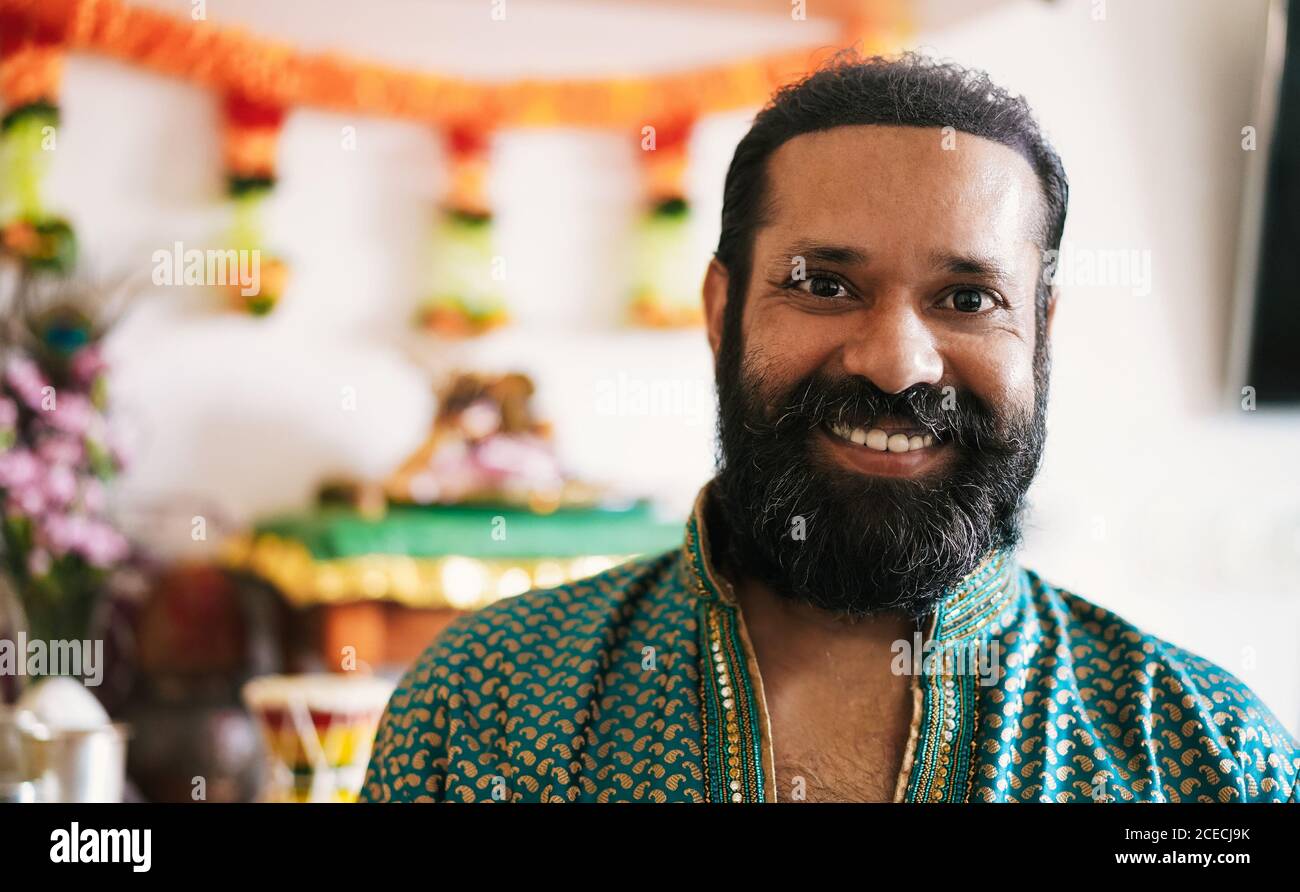 Portrait of indian man during religion fest at home - Hindu cultures ...