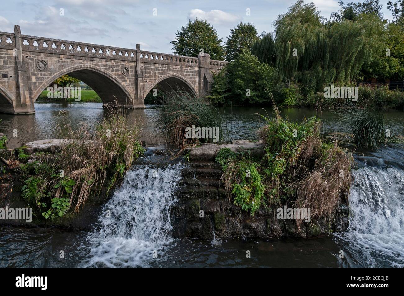 A small weir at Bathampton on Avon, a few miles from Bath in Britain ...