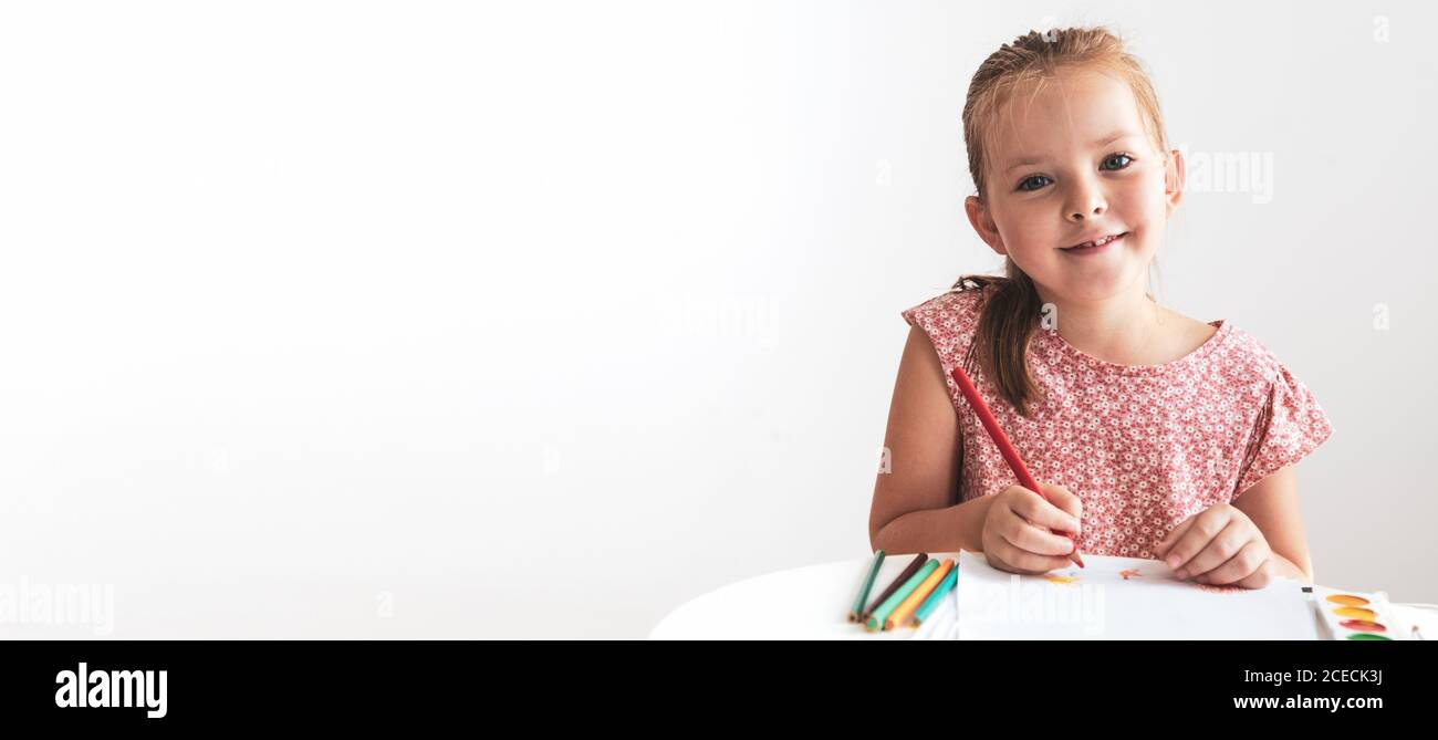 Little girl drawing. Homemade routine. School lessons. Kindergarten ...