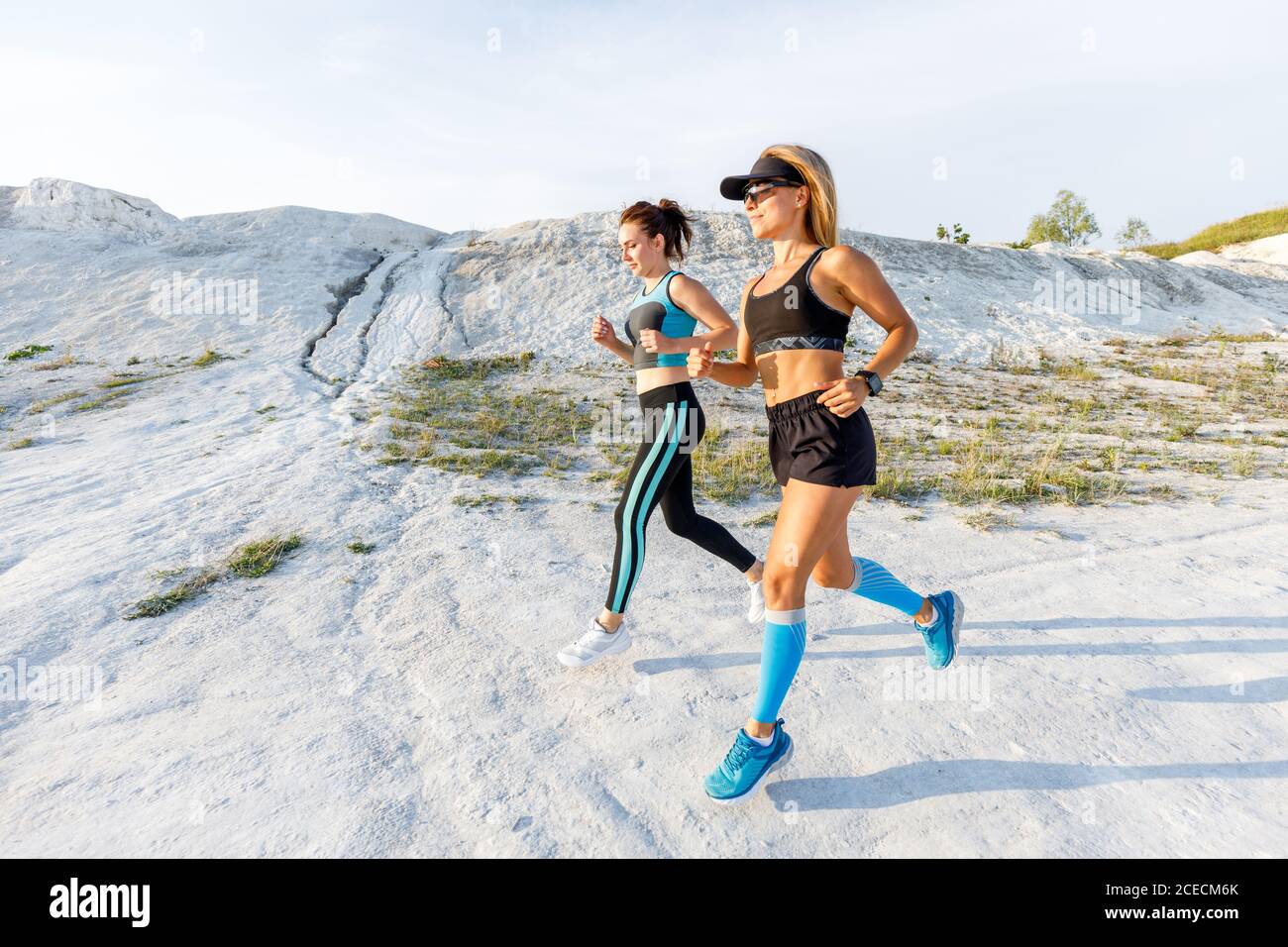 Two girls running hi-res stock photography and images - Alamy