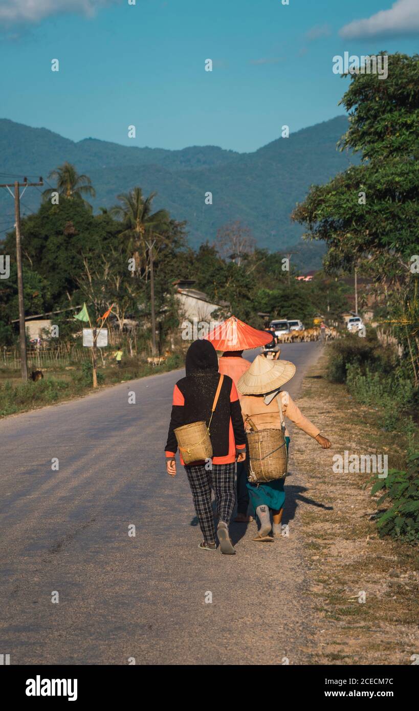 Local people walking on road Stock Photo - Alamy