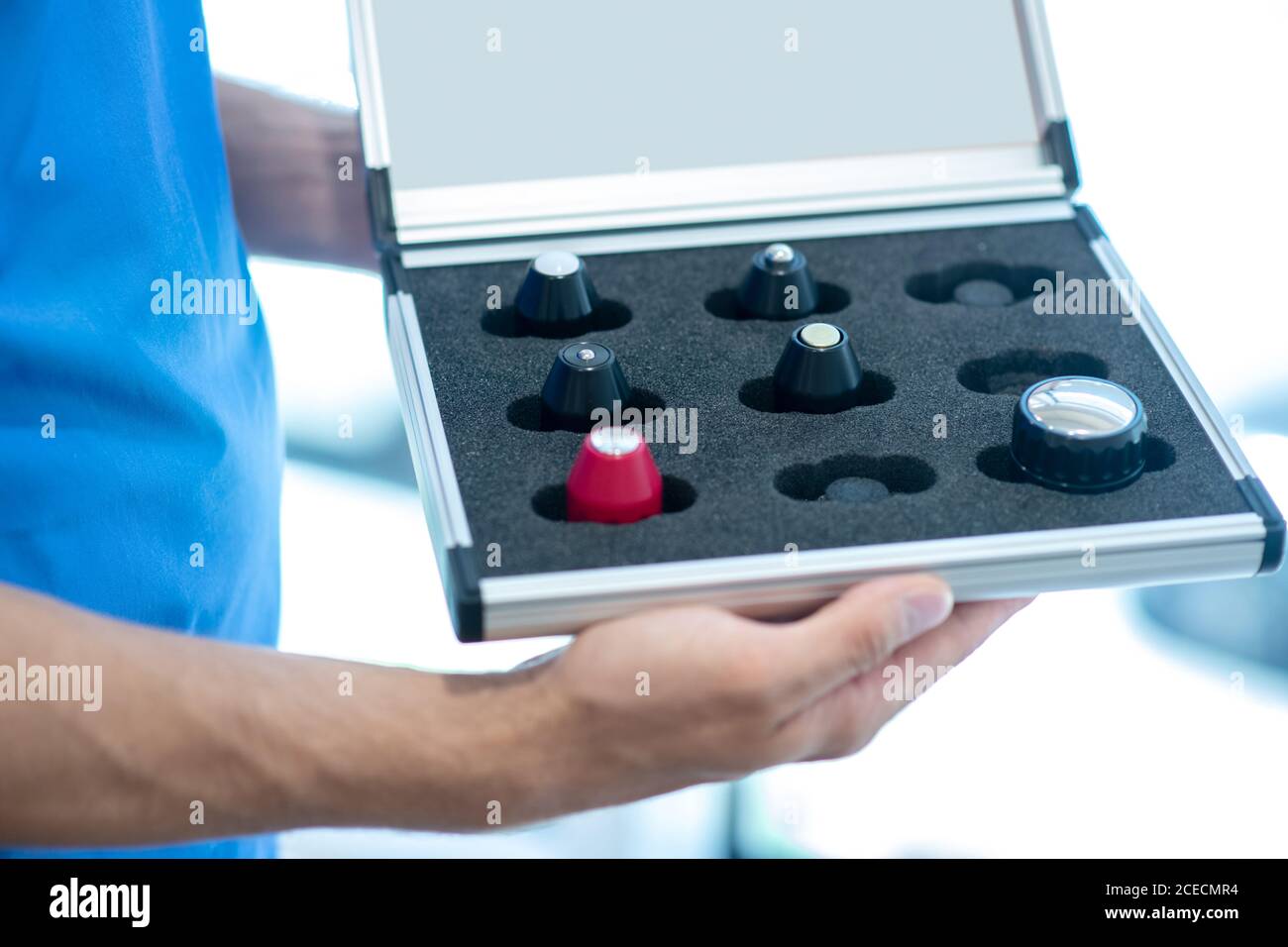 Open case with details in men hands Stock Photo - Alamy