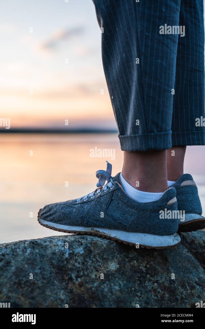 Person standing on rock hi-res stock photography and images - Alamy