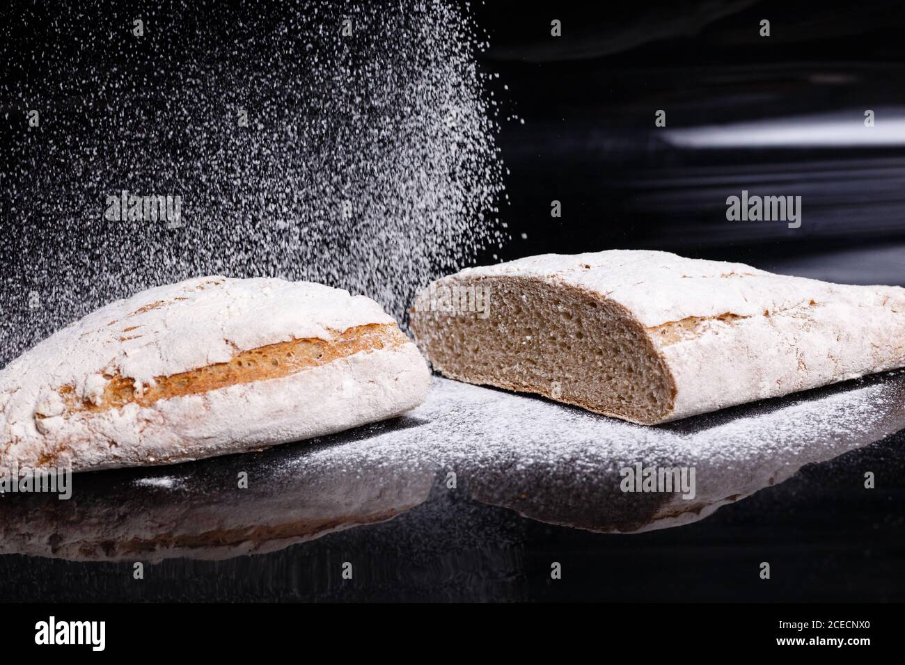 Gray bread sprinkled with flour. Homemade pastries, bread cut gavpil ...