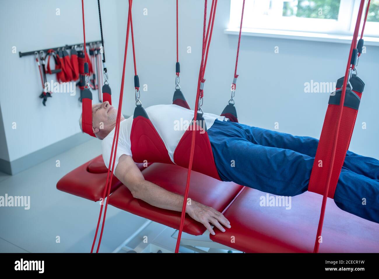 Man with closed eyes on rehabilitation at medical center Stock Photo ...