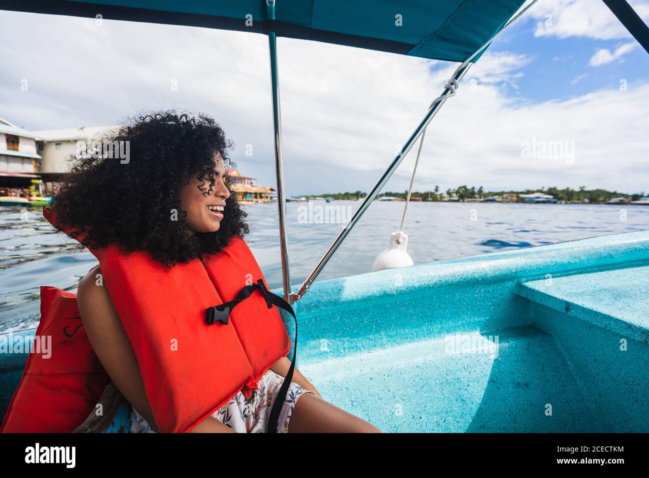 Young smiling lady on boat near water Stock Photo - Alamy
