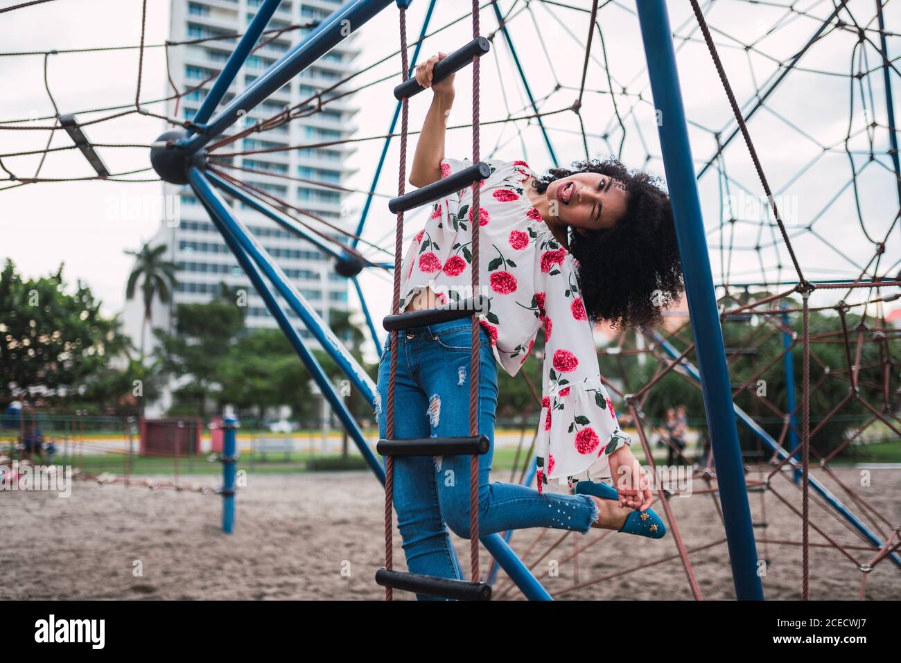 Woman on playground hi-res stock photography and images - Alamy