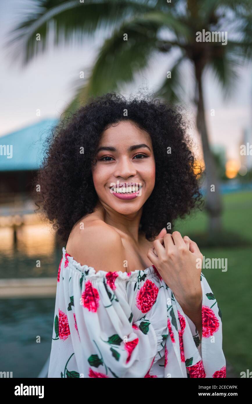 Beautiful black Woman on tropical city seafront Stock Photo - Alamy