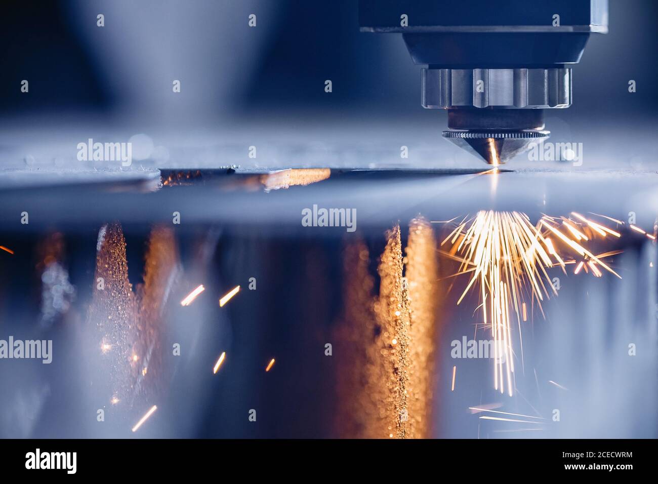 Laser CNC cutting of metal with light spark, modern industrial ...