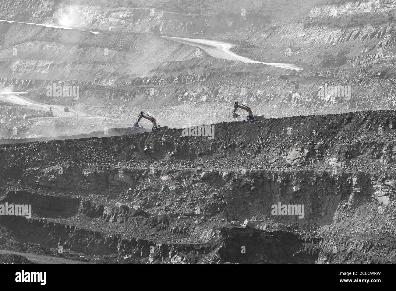 Concept open pit mine industry. Metaphor giraffes excavator moving end ...