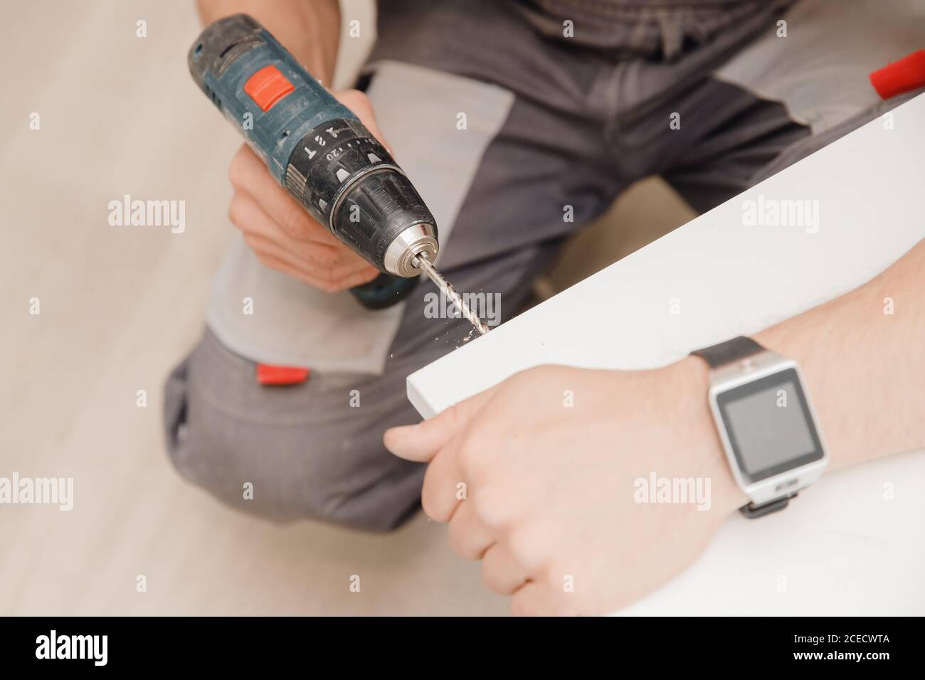Kitchen installation, worker furniture assembly with tools Stock Photo ...