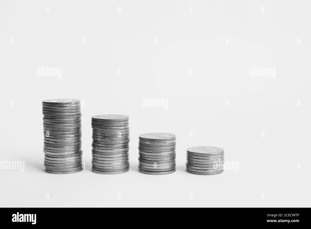 Savings concept coins on Black and White Stock Photos & Images - Alamy