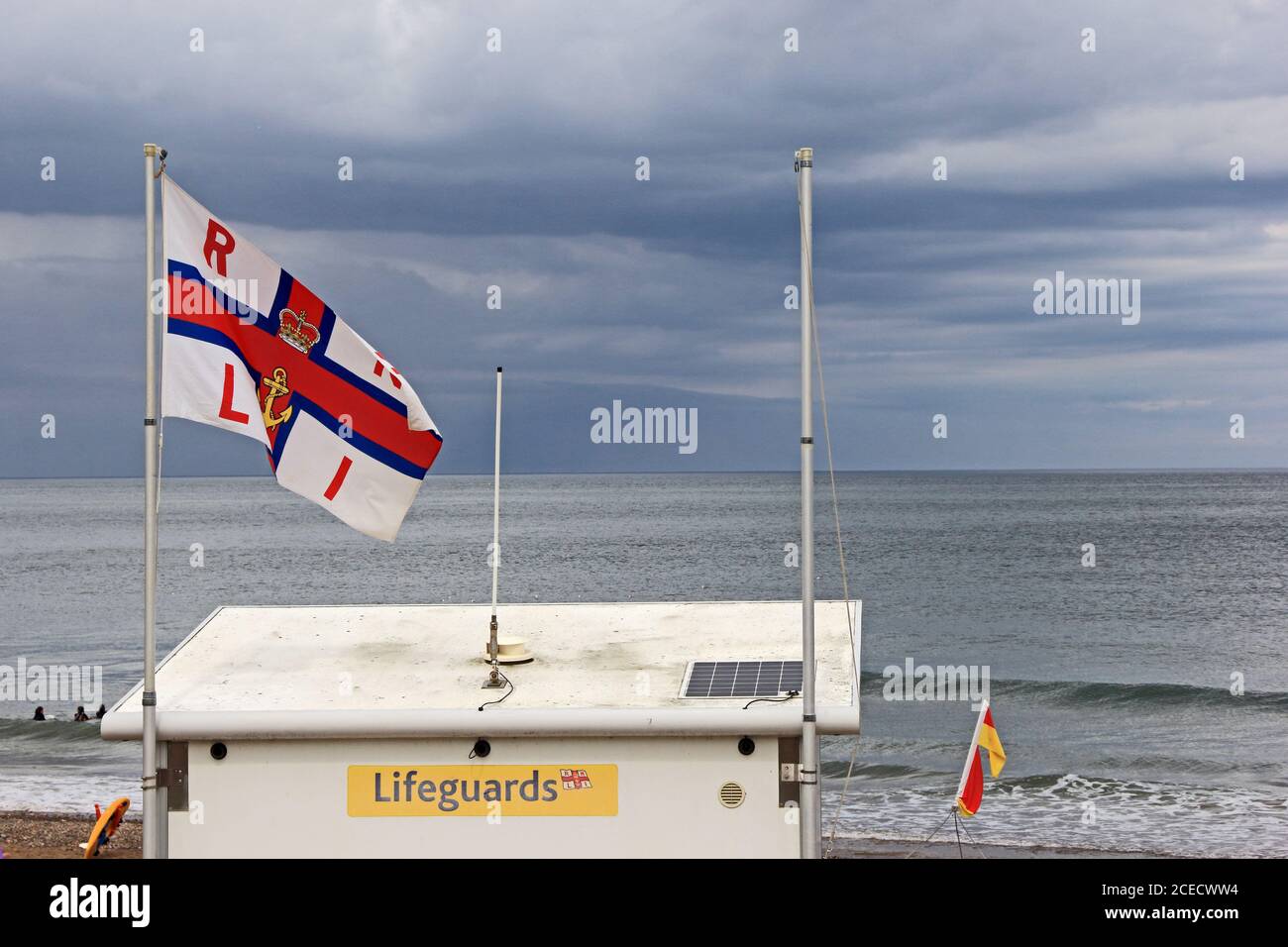 RNLI flag flying over Lifeguard Station, Sandsend, Whitby Stock Photo ...