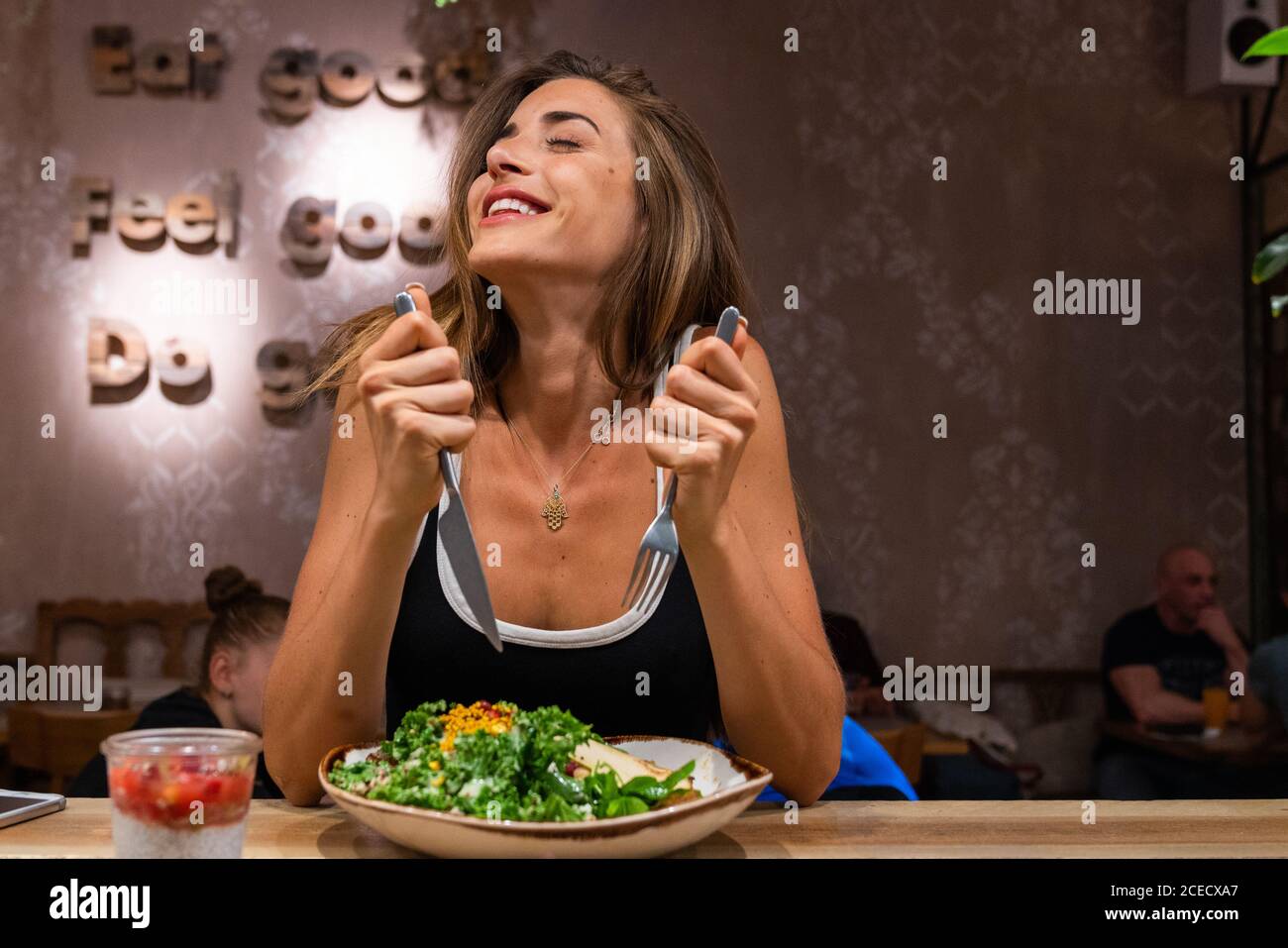 Woman hungry at table hi-res stock photography and images - Alamy