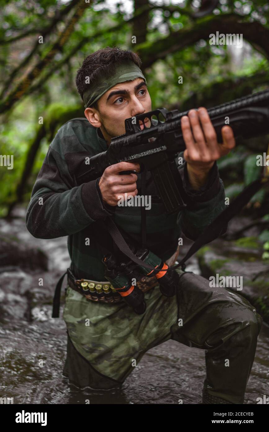 Inside the stream, soldier or revolutionary member or hunter in ...