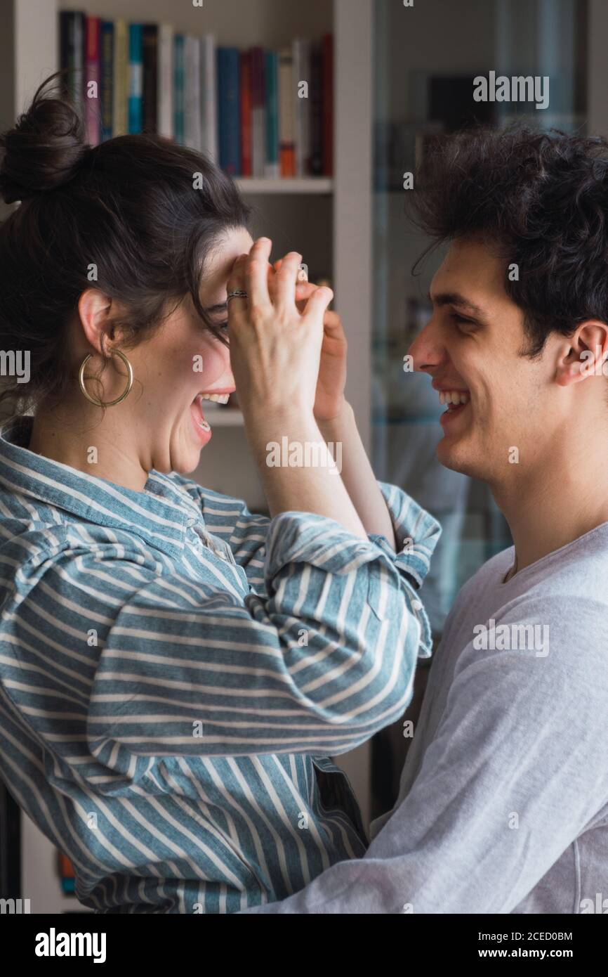 Romantic couple relaxing embracing home hi-res stock photography and ...