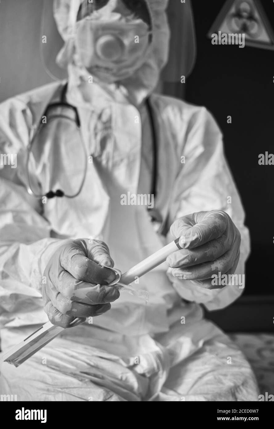 Vertical cropped snapshot of doctor holding COVID-19 swab collection ...