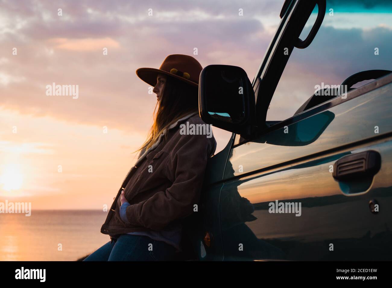 Woman leaning car hi-res stock photography and images - Alamy