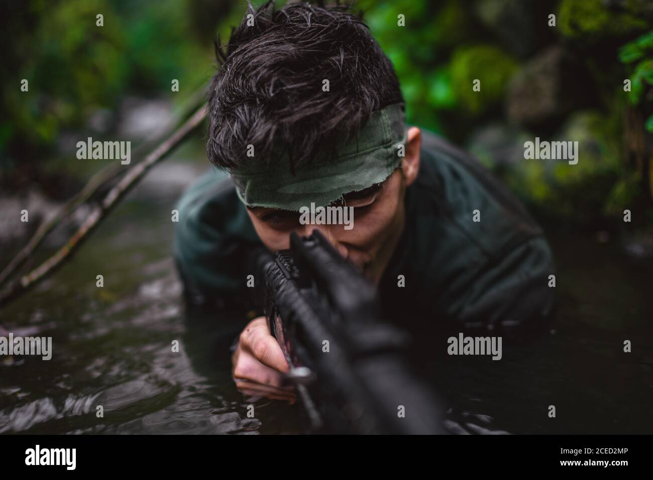 Soldier or revolutionary member or hunter aiming with gun in his hand ...