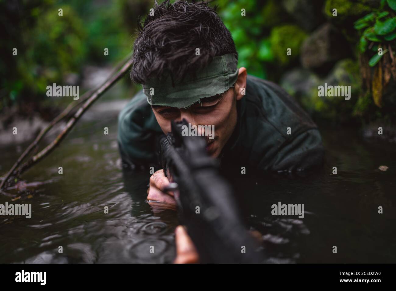 Soldier or revolutionary member or hunter aiming with gun in his hand ...