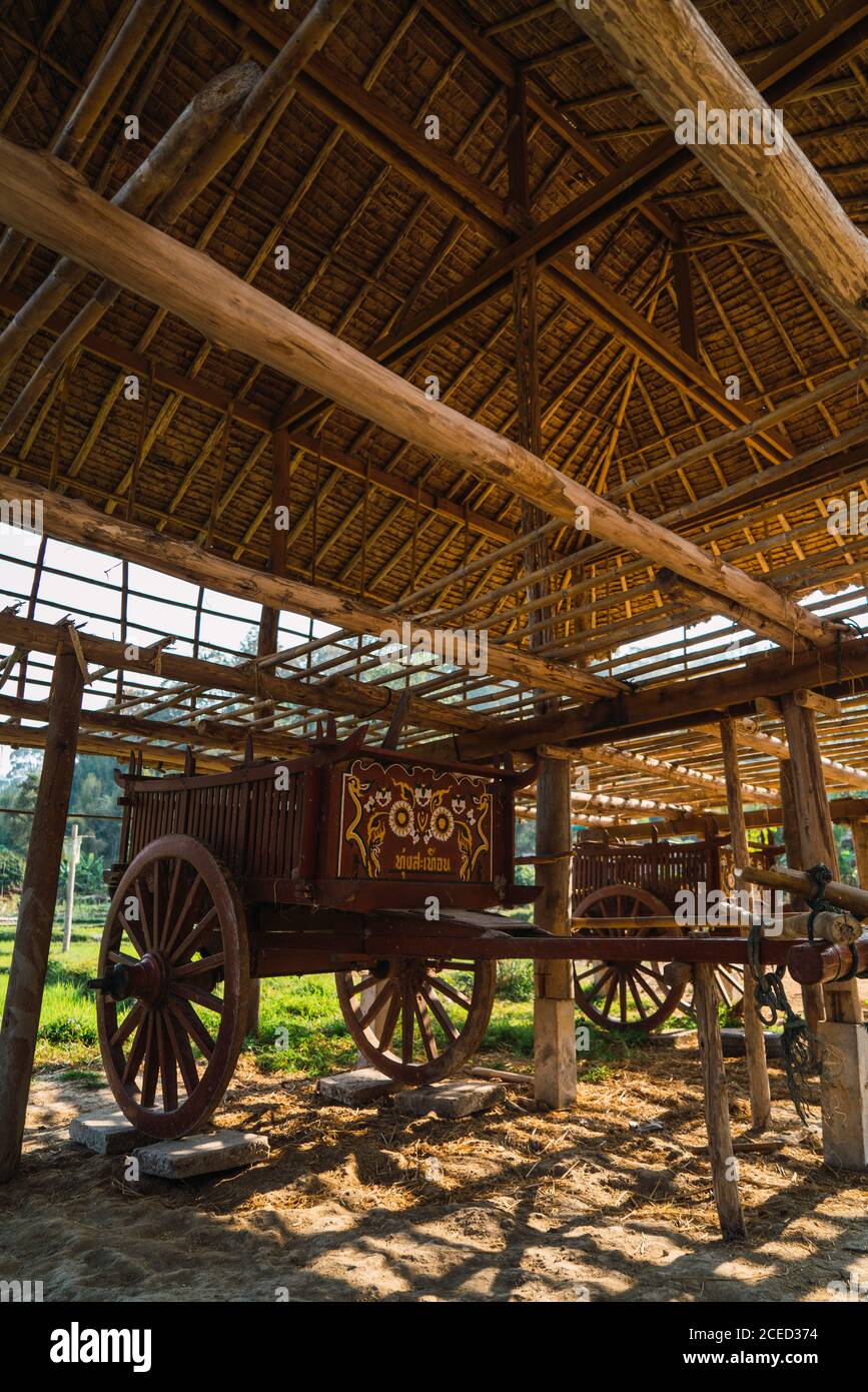 Big vintage wooden wagon under the roof in the village Stock Photo - Alamy