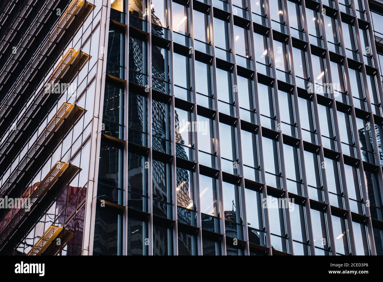 Glass walls of beautiful skyscraper located on streets of Singapore ...