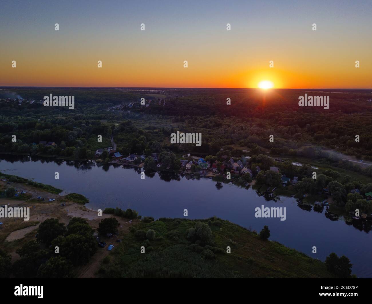 Sunset above the river in natural rural landscape Stock Photo - Alamy