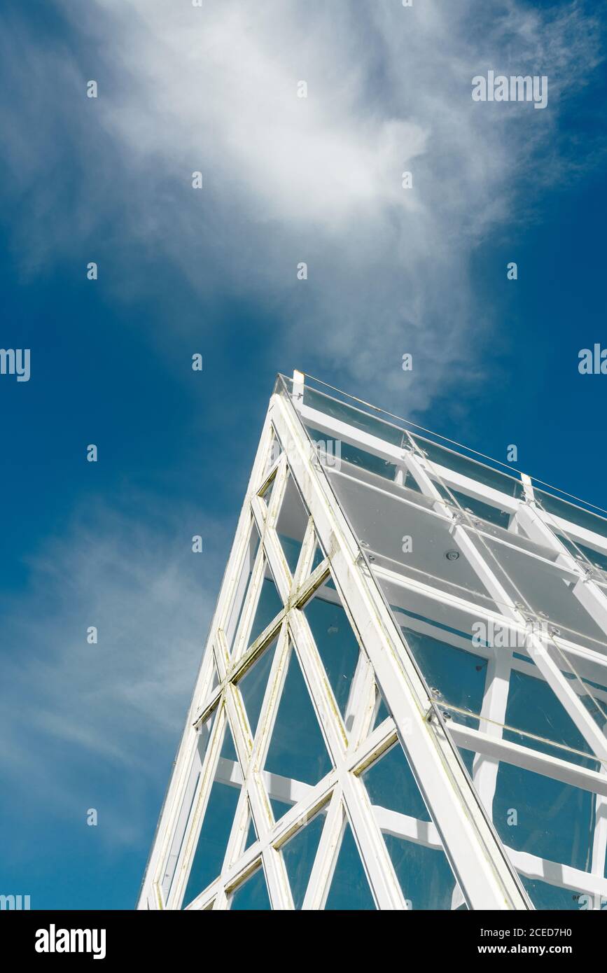 Glass slope roof under blue sky Stock Photo - Alamy