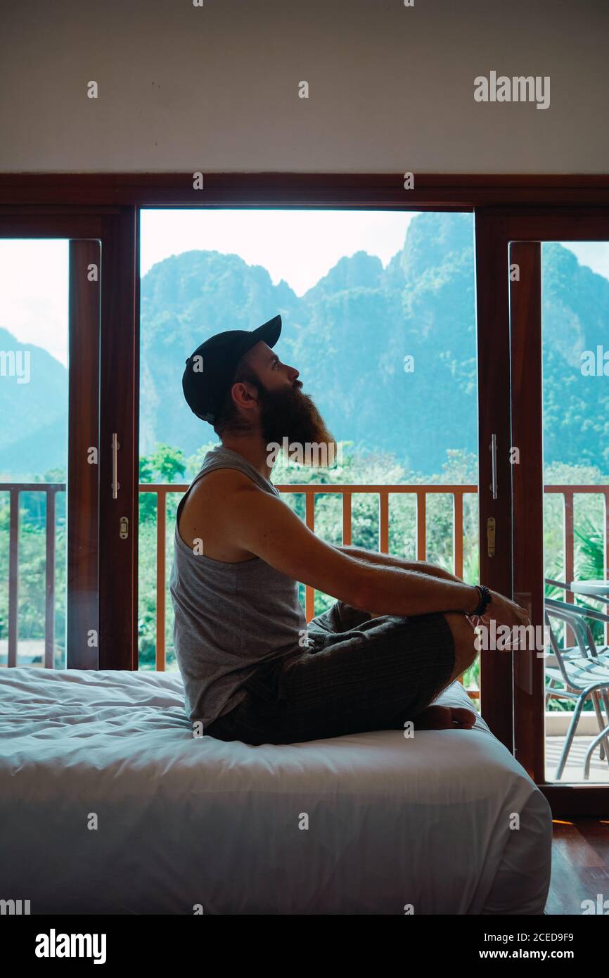Man sitting up in bed hi-res stock photography and images - Alamy