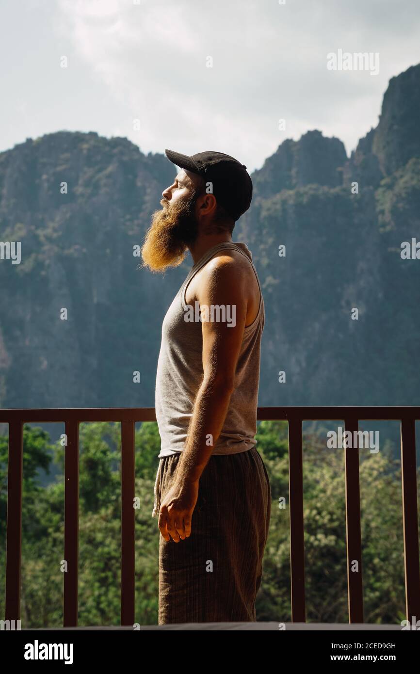 man standing on balcony Stock Photo - Alamy