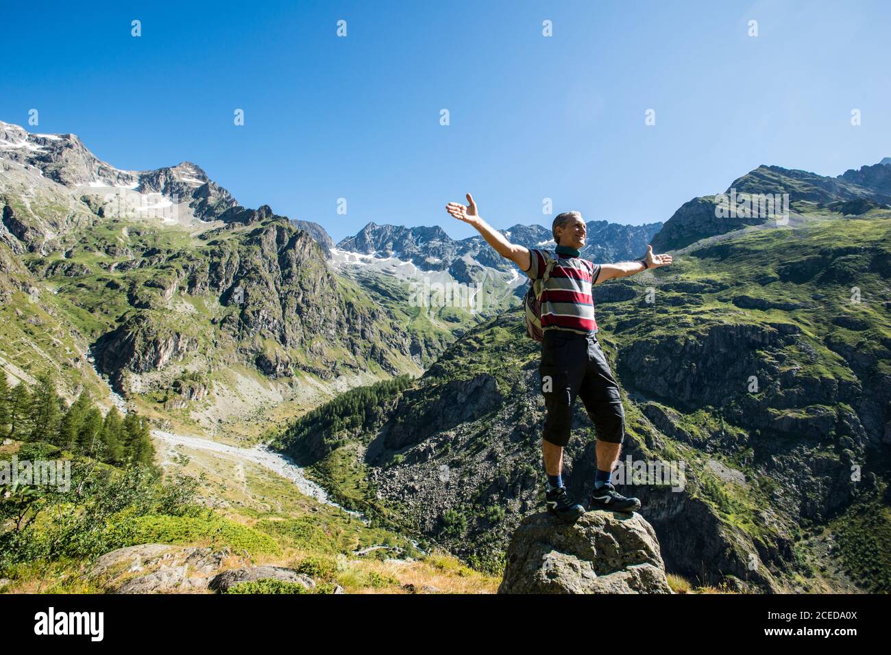 Adult man climbing the French Alps Stock Photo - Alamy