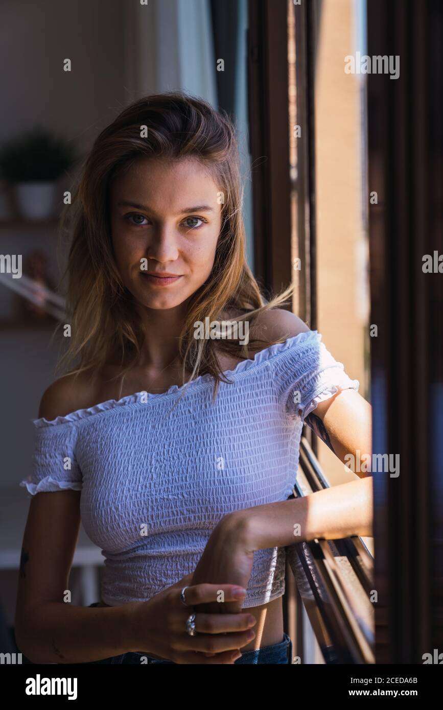 Pretty Woman posing near window Stock Photo - Alamy