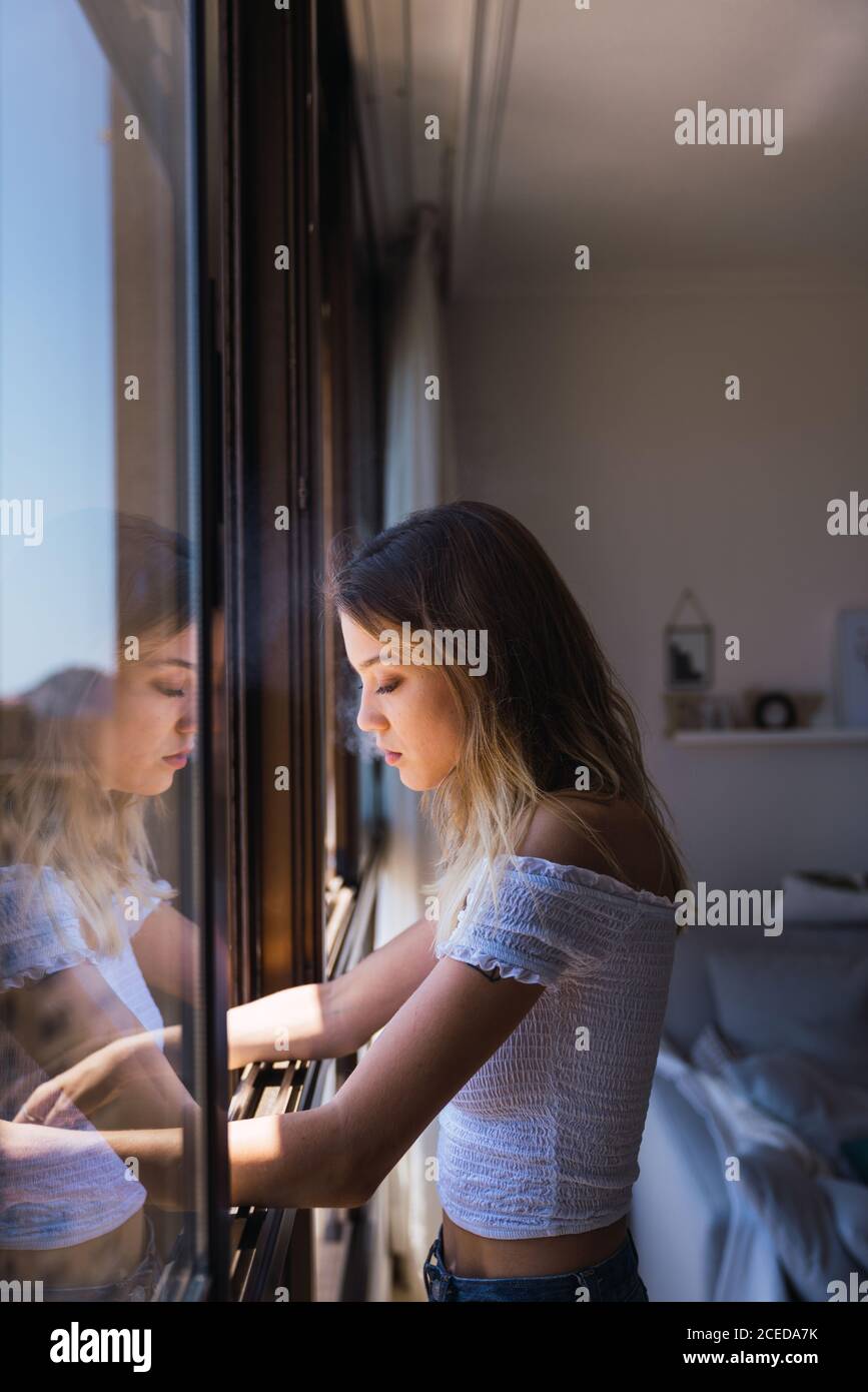 Pretty Woman posing near window Stock Photo - Alamy