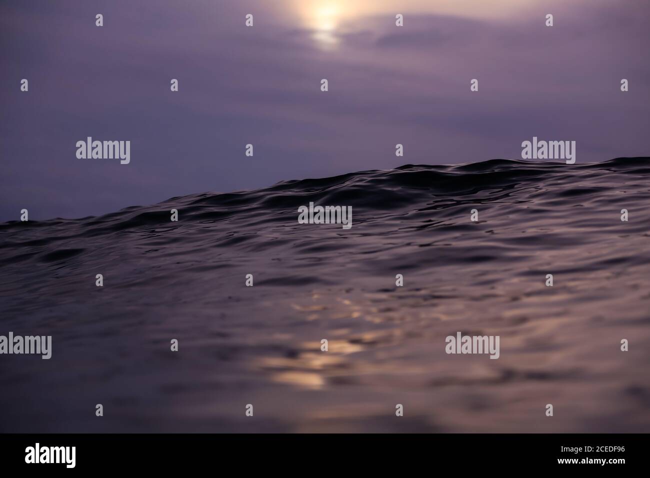 Closeup water wave of sea and cloudy heaven with sun on Bali, Indonesia ...