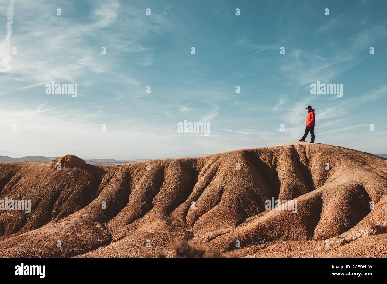 Tourist on sandy canyon hills Stock Photo - Alamy