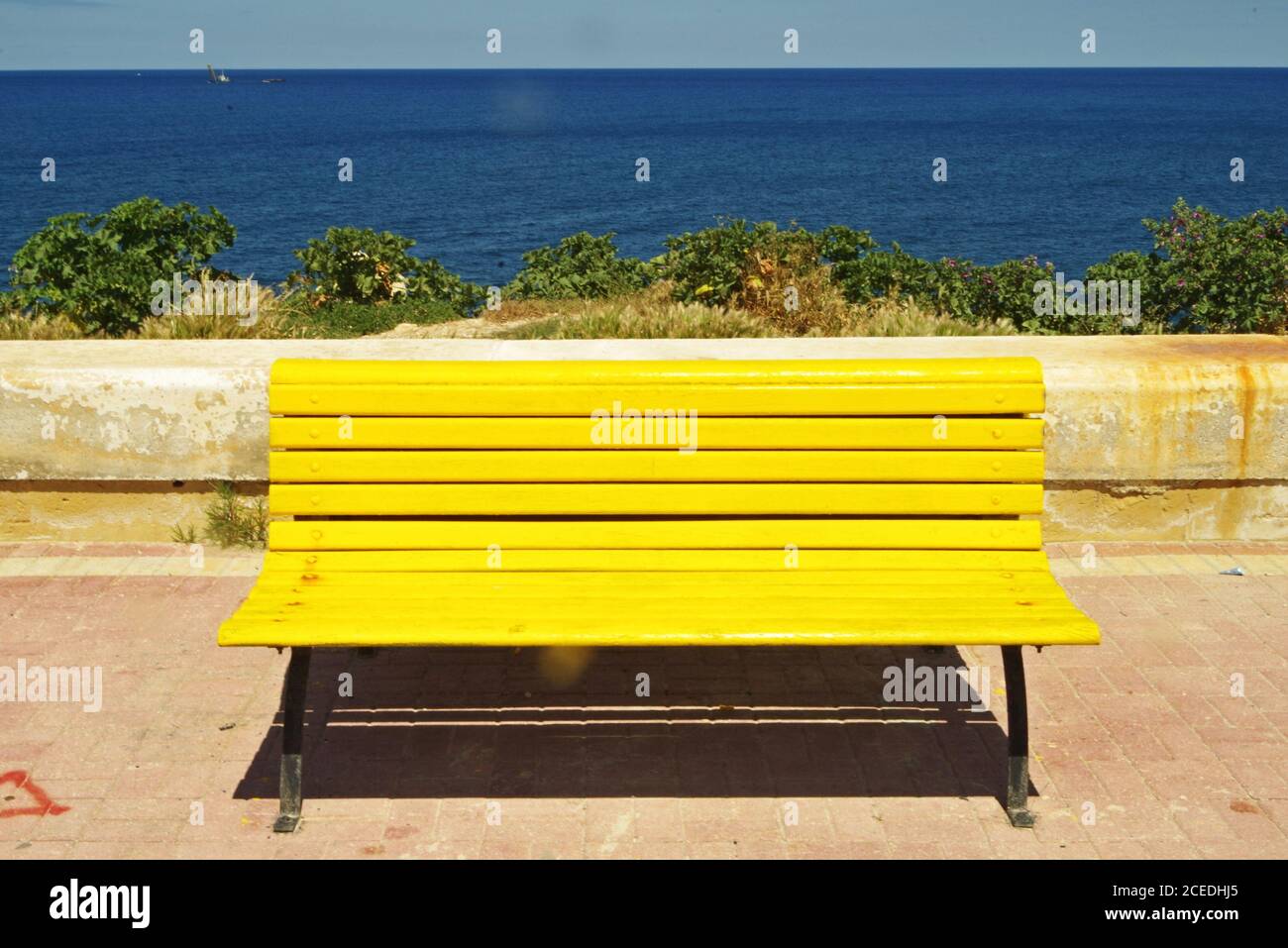Yellow bench on the beach, Malta Stock Photo - Alamy