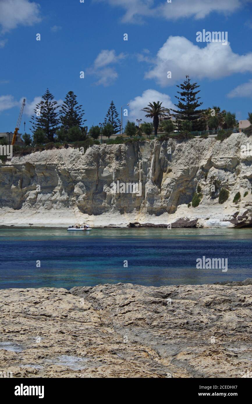 Beach and rocks, St Thomas bay, Malta Stock Photo - Alamy