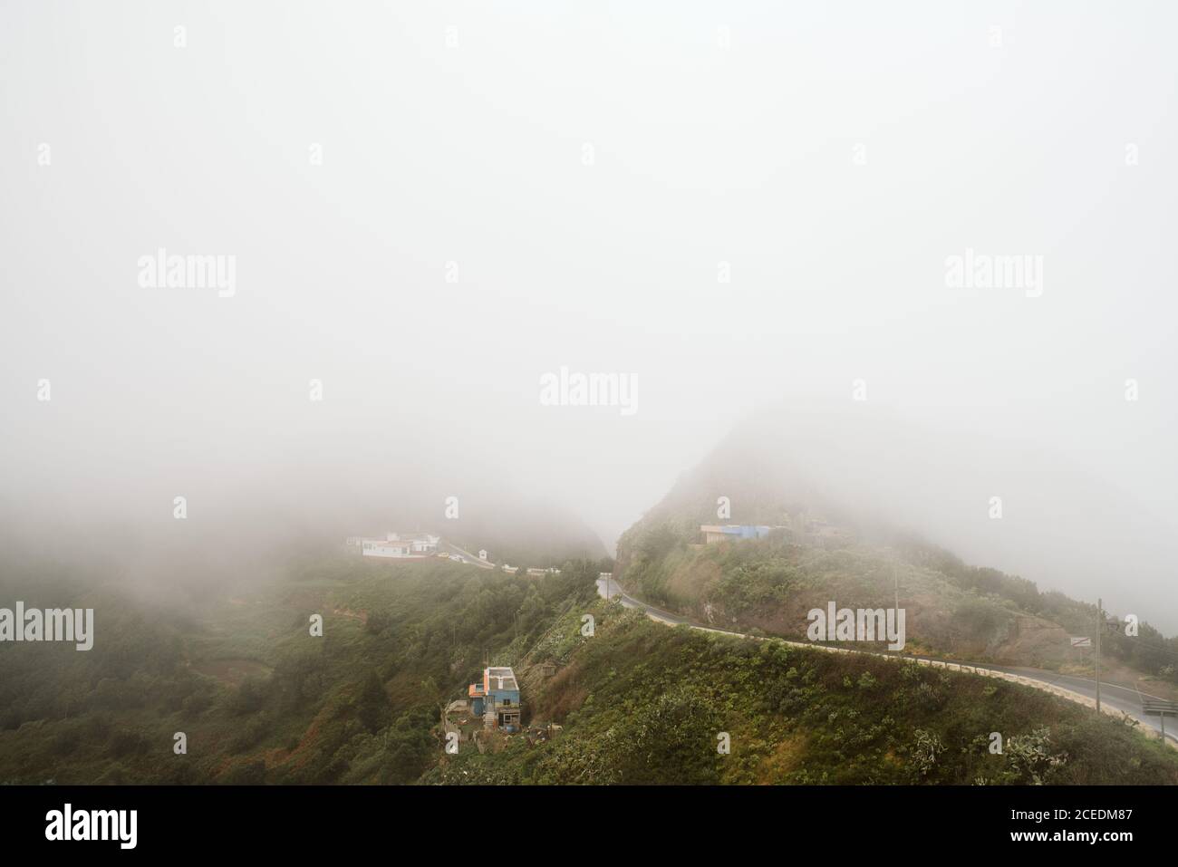 Fog over beautiful hilly terrain Stock Photo - Alamy