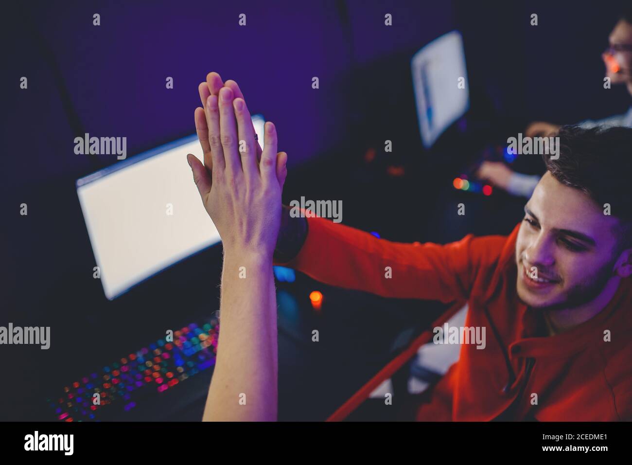 Professional gamer greeting and support team fists hands online game in ...