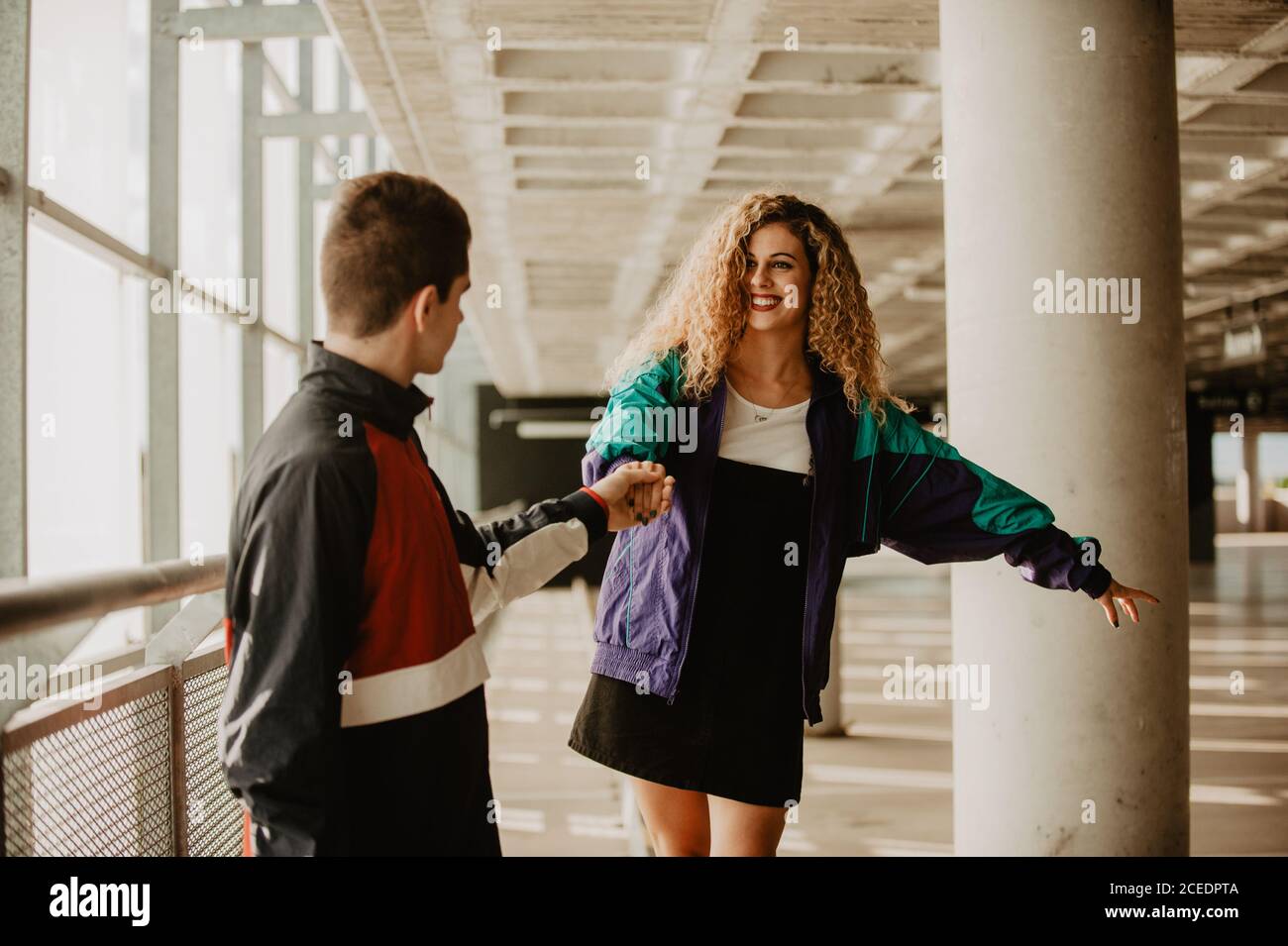 Young couple in roofed pathway Stock Photo - Alamy