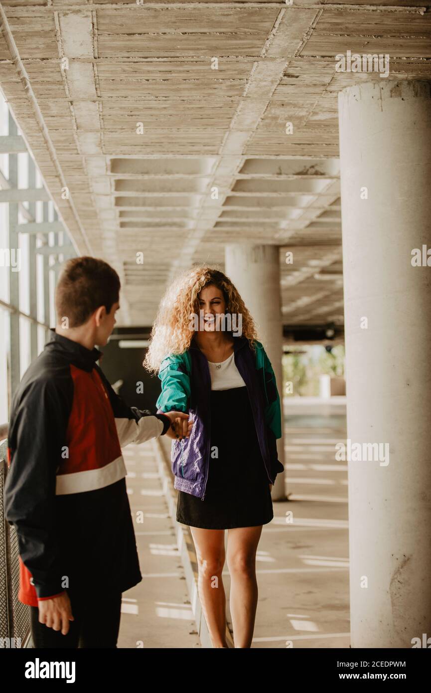 Young couple in roofed pathway Stock Photo - Alamy