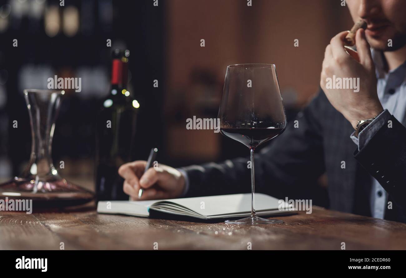 Winemaker sommelier man sniffing aroma red wine in glass Stock Photo ...