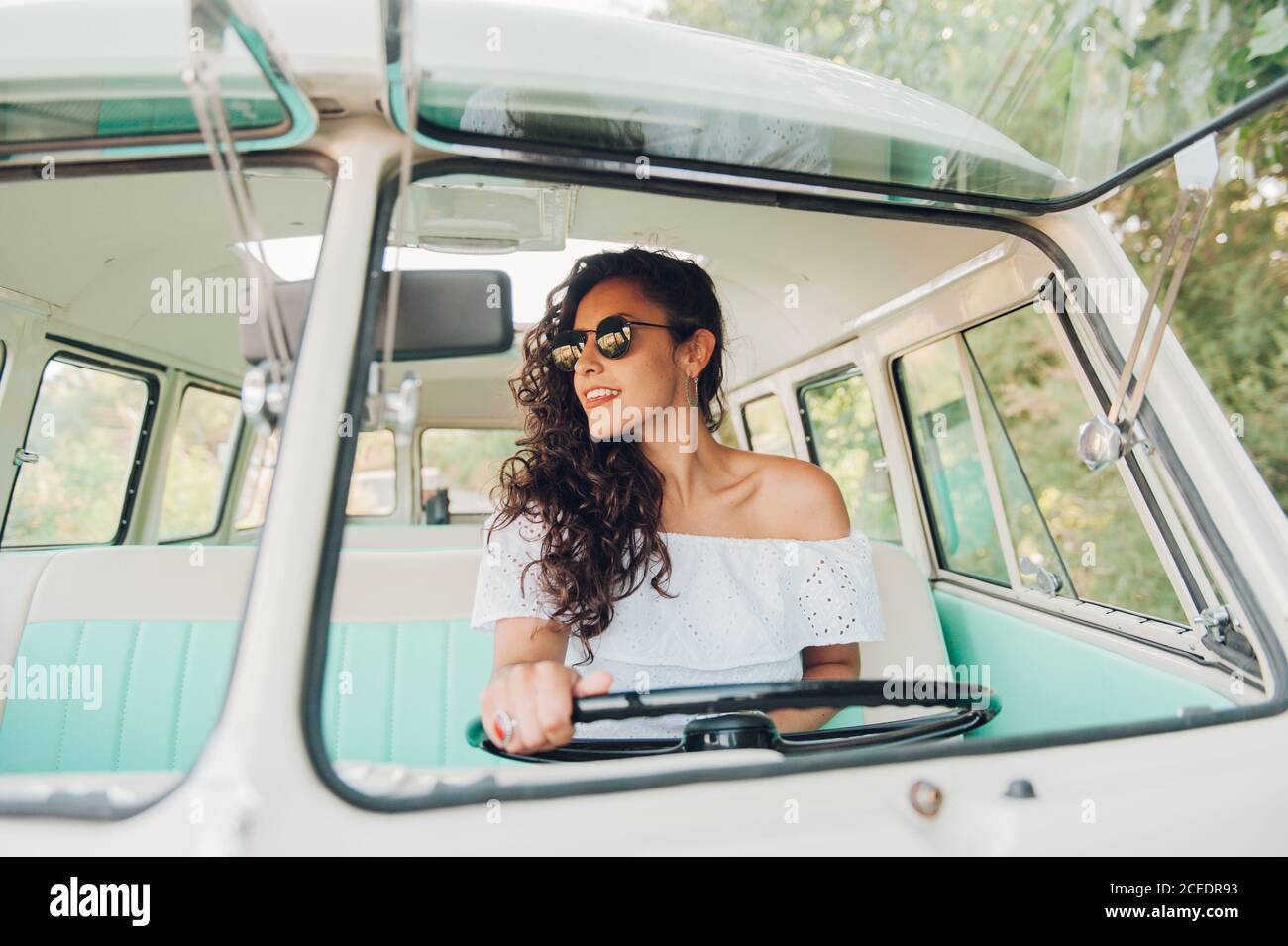 Woman driving retro car Stock Photo - Alamy