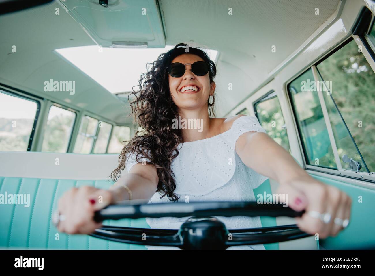 Woman driving retro car Stock Photo - Alamy