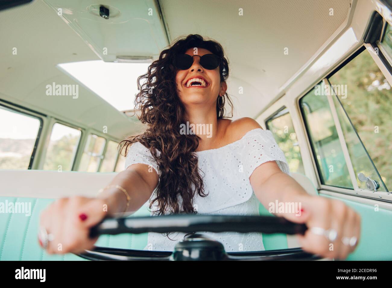Woman driving retro car Stock Photo - Alamy