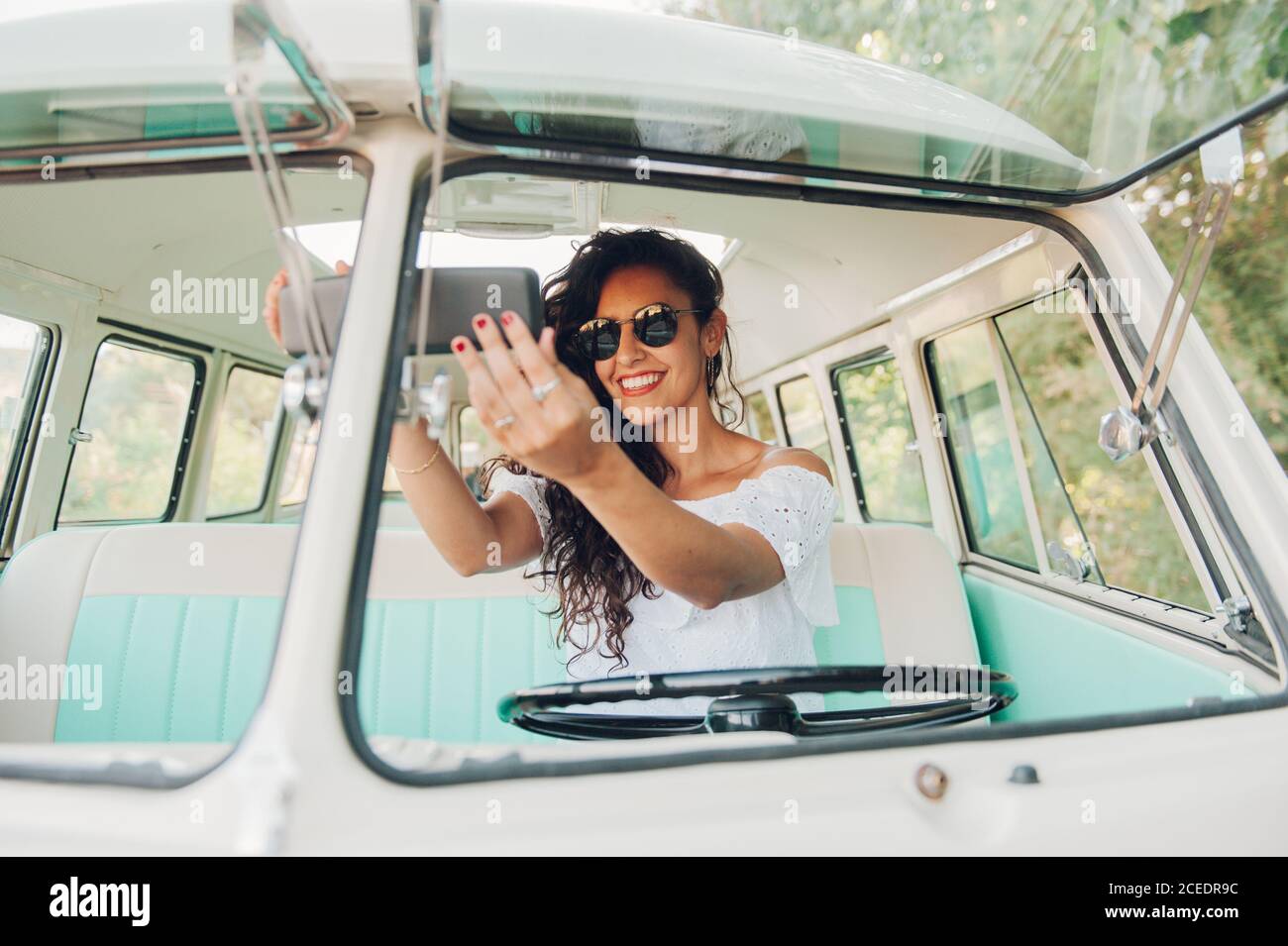 Woman driving retro car Stock Photo - Alamy
