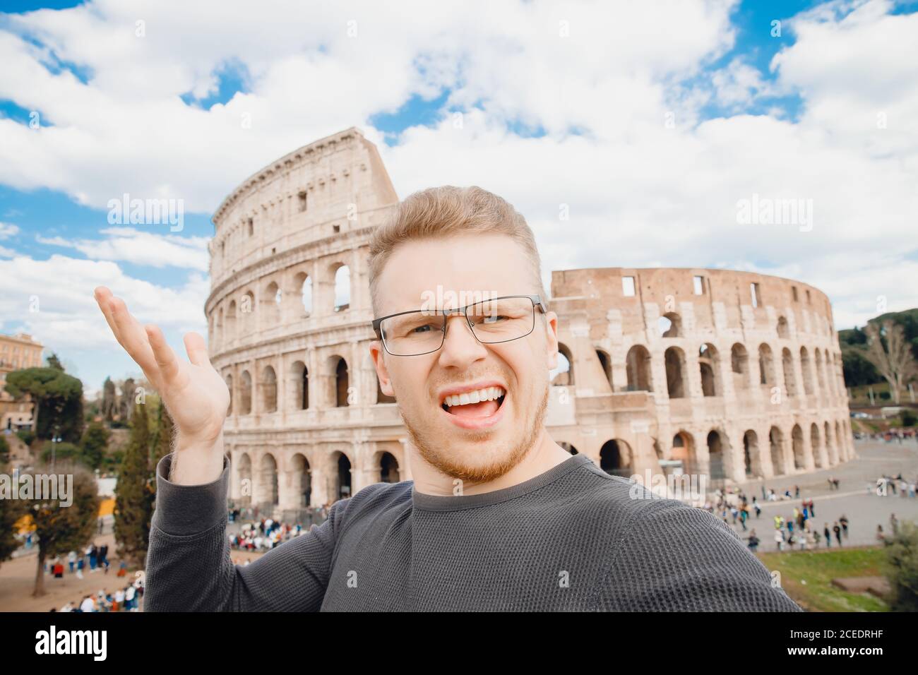Happy young man making selfie Colosseum in Rome, Italy. Concept travel ...