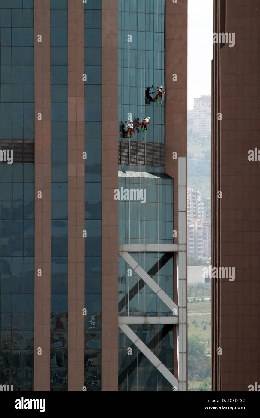 Glass of very tall buildings and skyscrapers in Turkey cleaned by ...